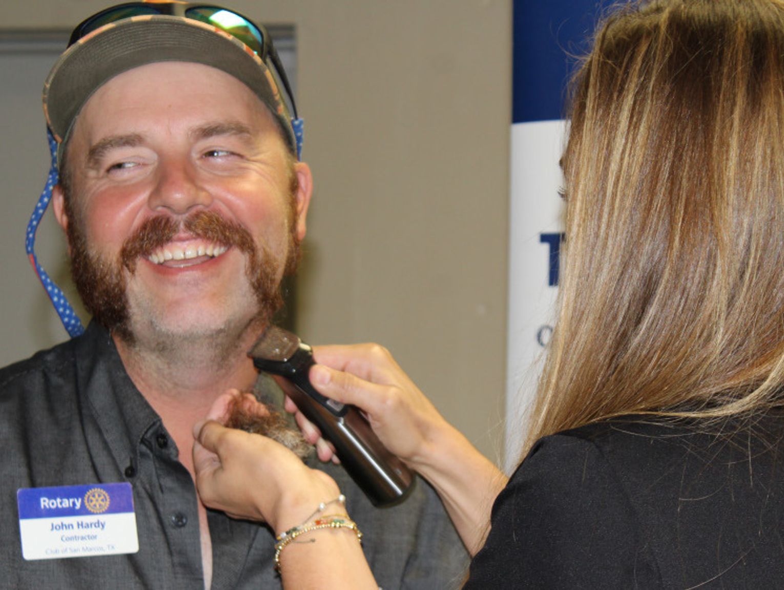 Rotary member shaves beard to help raise $6,000 for CASA